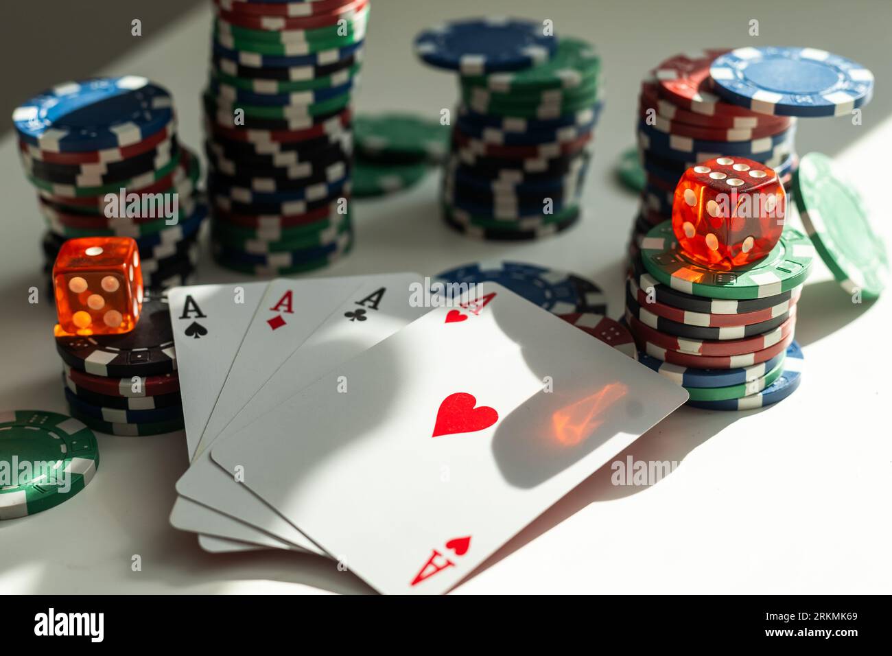 Studio shot composition of poker chips, dices, playing cards, coins and ...