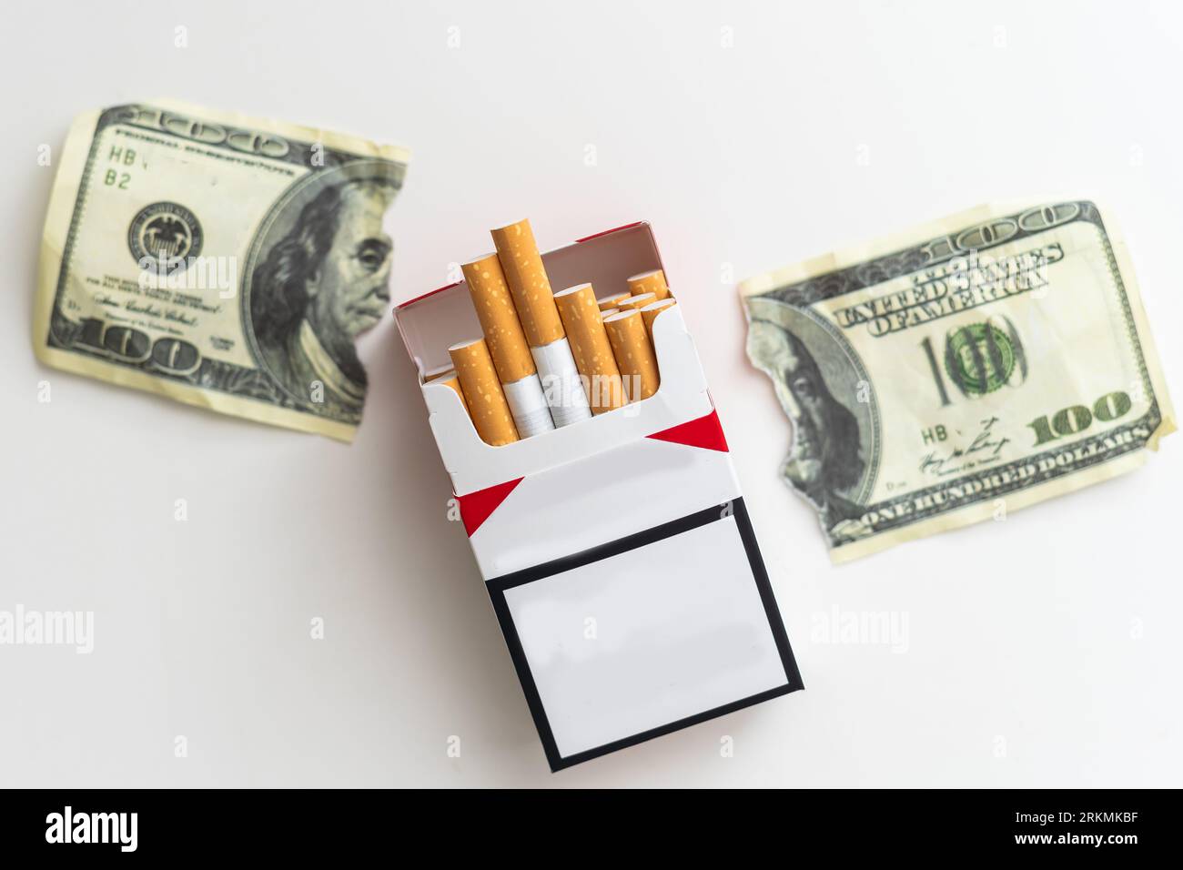 Cigarettes and dollar as aconcept of smoking costs Stock Photo - Alamy