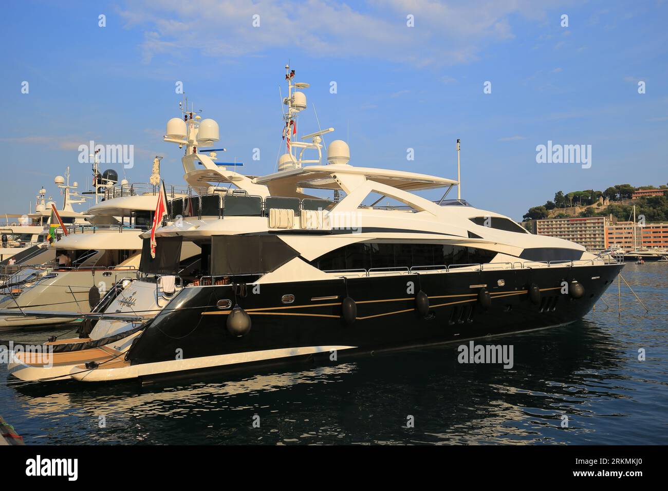Luxury super yachts moored in the port Hercules in Monaco Stock Photo ...