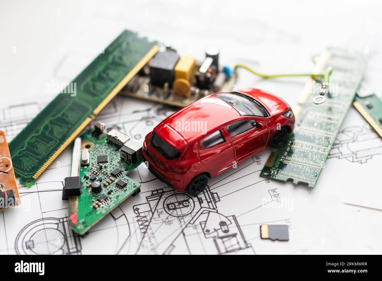 Toy cars on electronic board and microchip. Conceptual image for ...