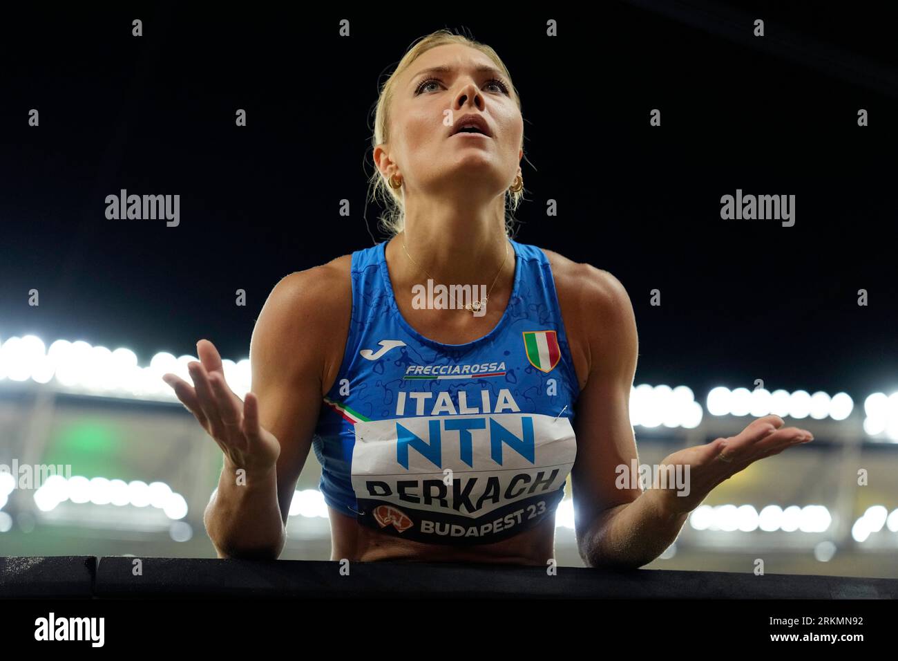 Dariya Derkach, of Italy, talks to her coach while competing in the ...
