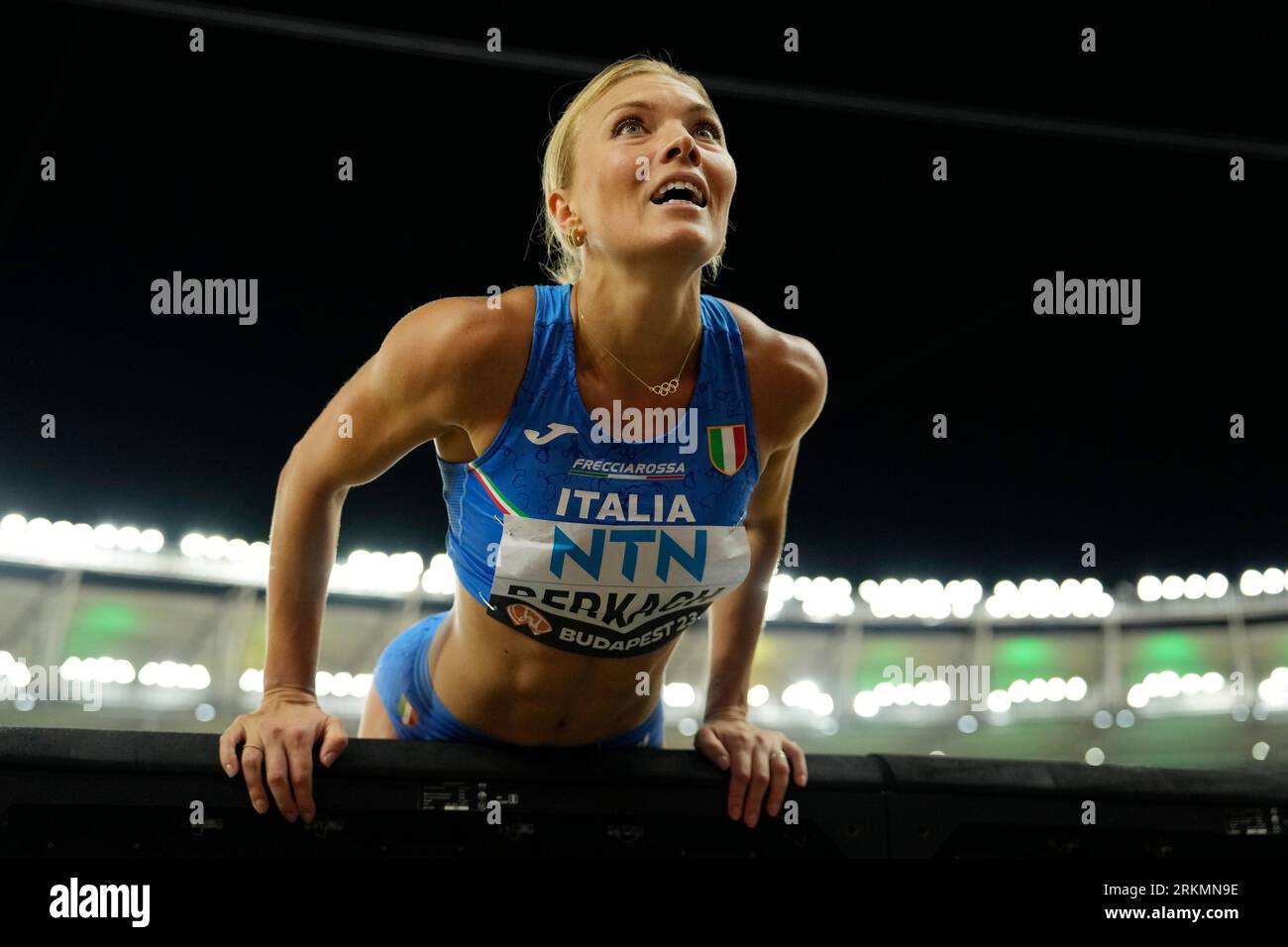 Dariya Derkach, of Italy, talks to her coach while competing in the ...