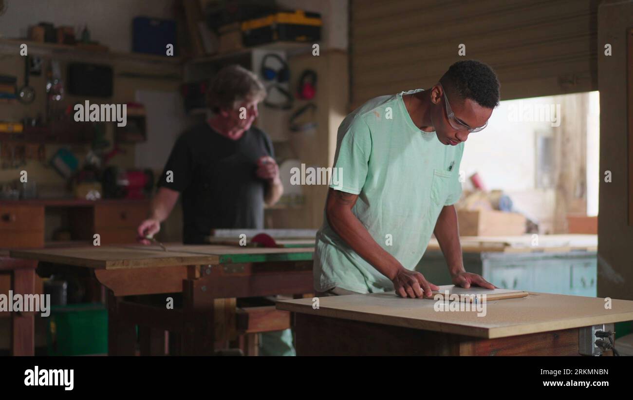 Candid Carpentry Workshop Scene of Master Carpenter and Apprentice at ...