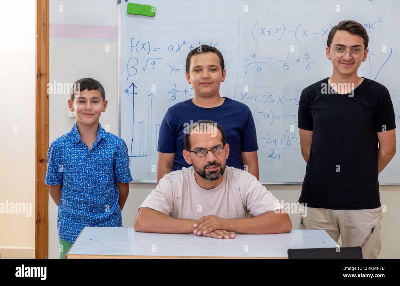 school kids standing beside each other while smiling Stock Photo - Alamy