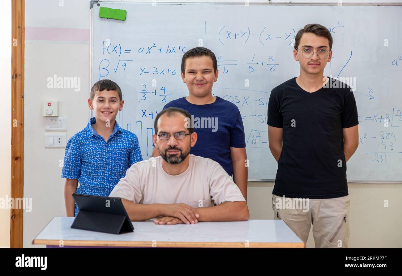 school kids standing beside each other while smiling Stock Photo - Alamy