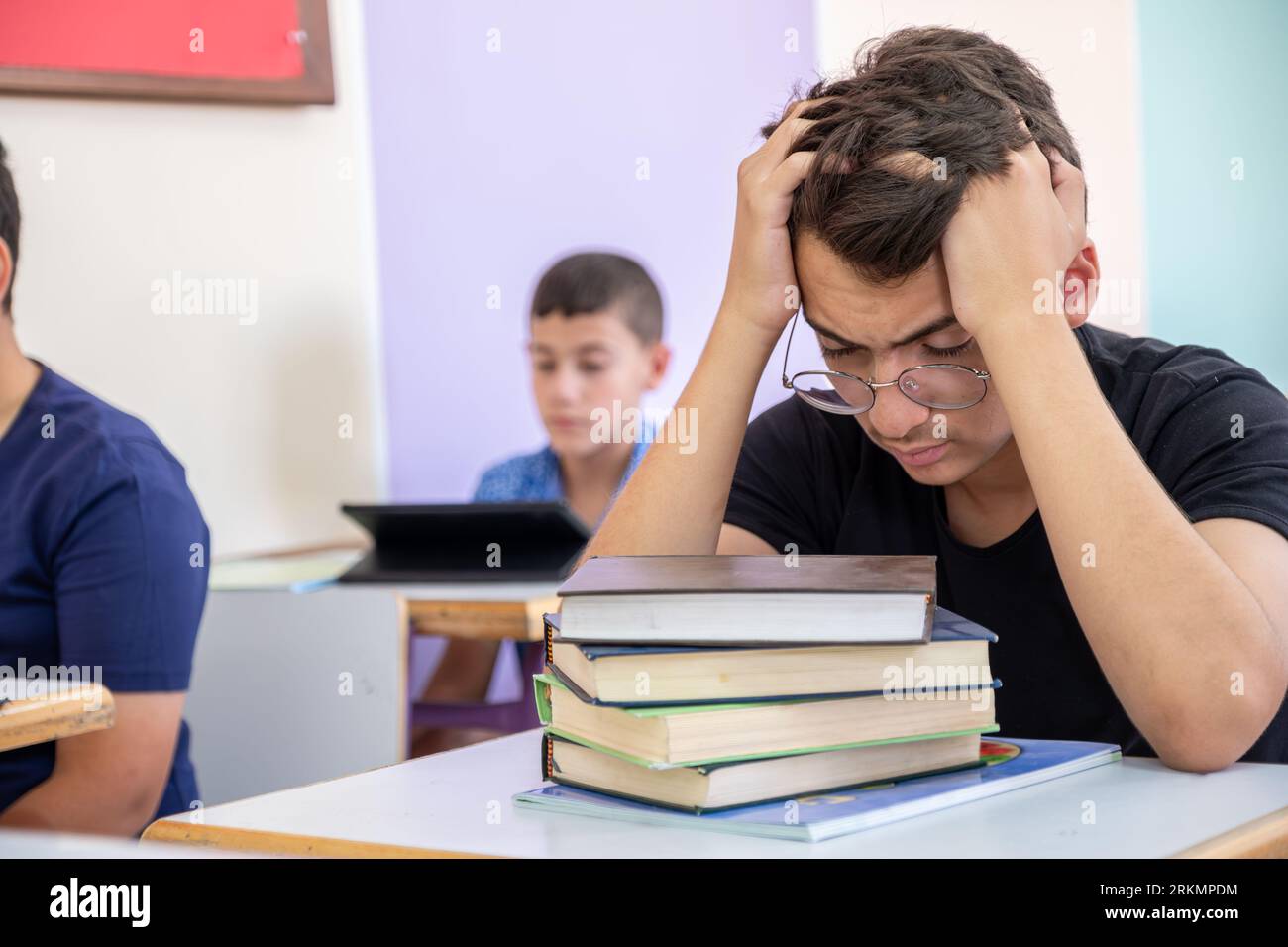 Student feeling frustrated due to the load of studying Stock Photo - Alamy