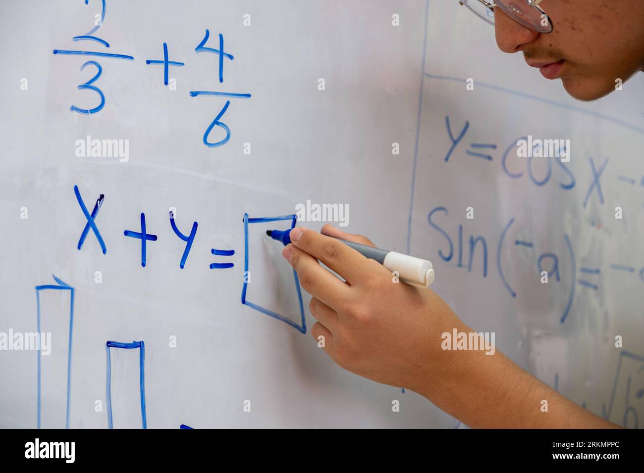 hand of student writing on board Stock Photo - Alamy