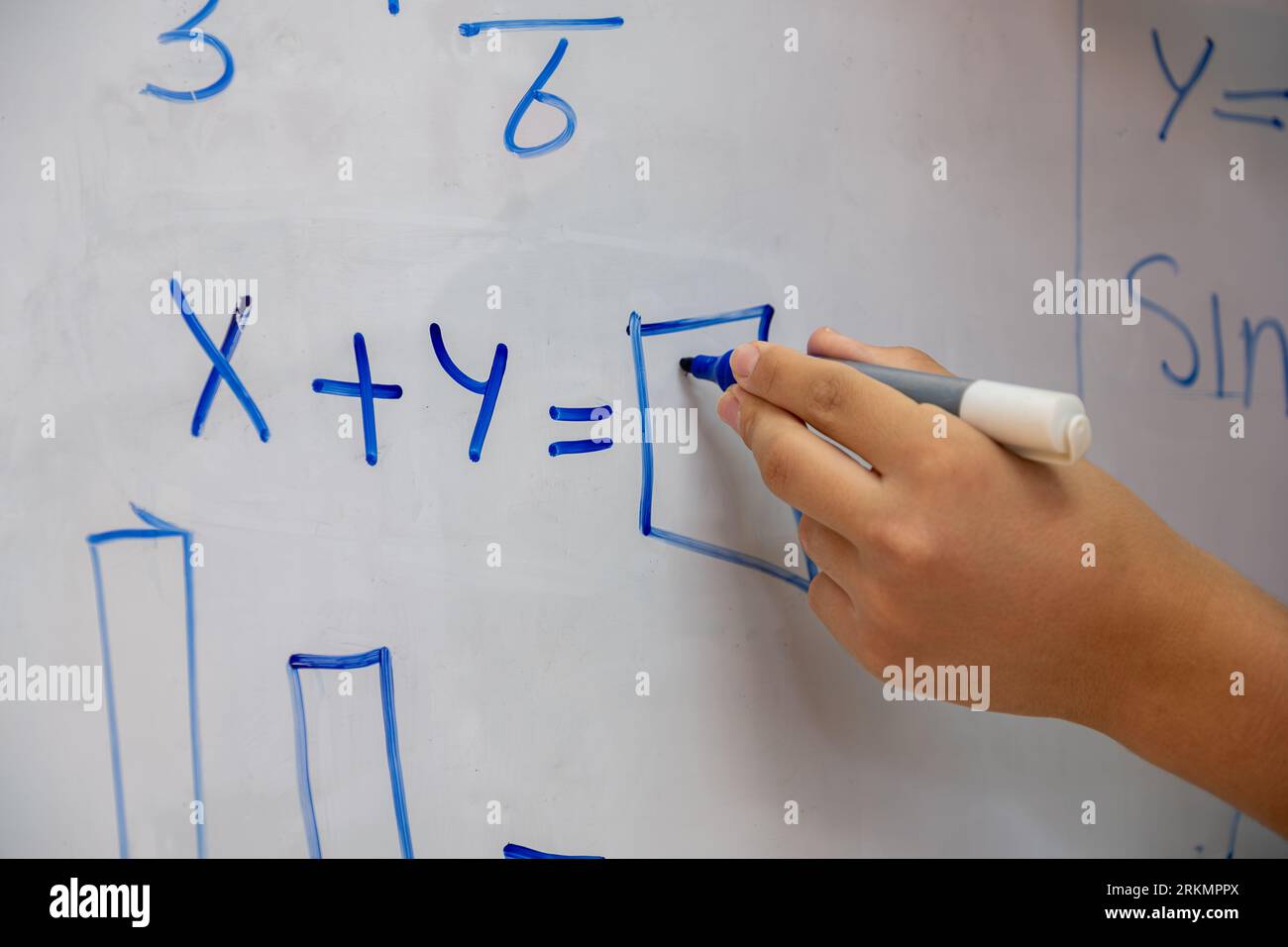 hand of student writing on board Stock Photo - Alamy