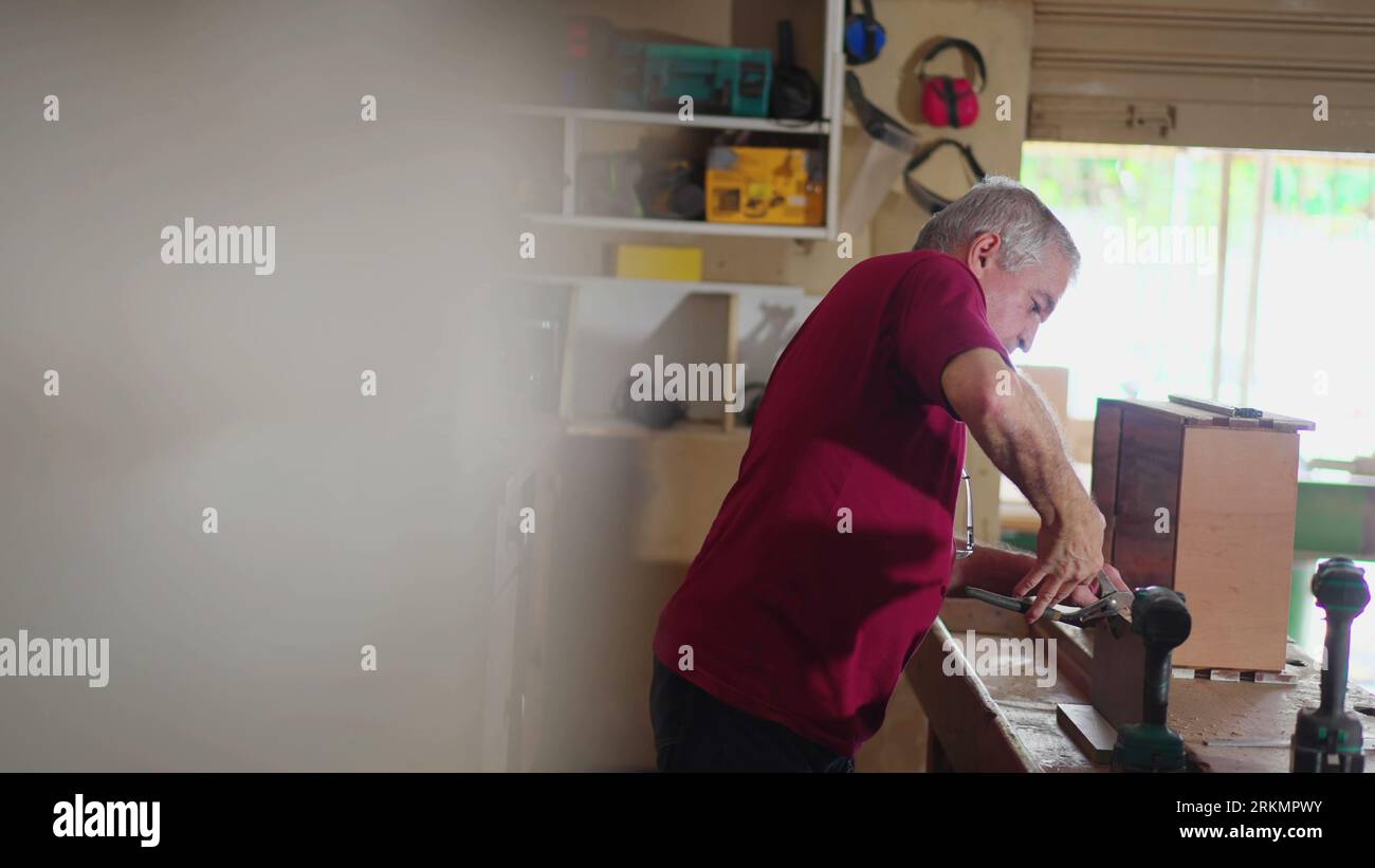 Older man working workshop grabbing hi-res stock photography and images ...