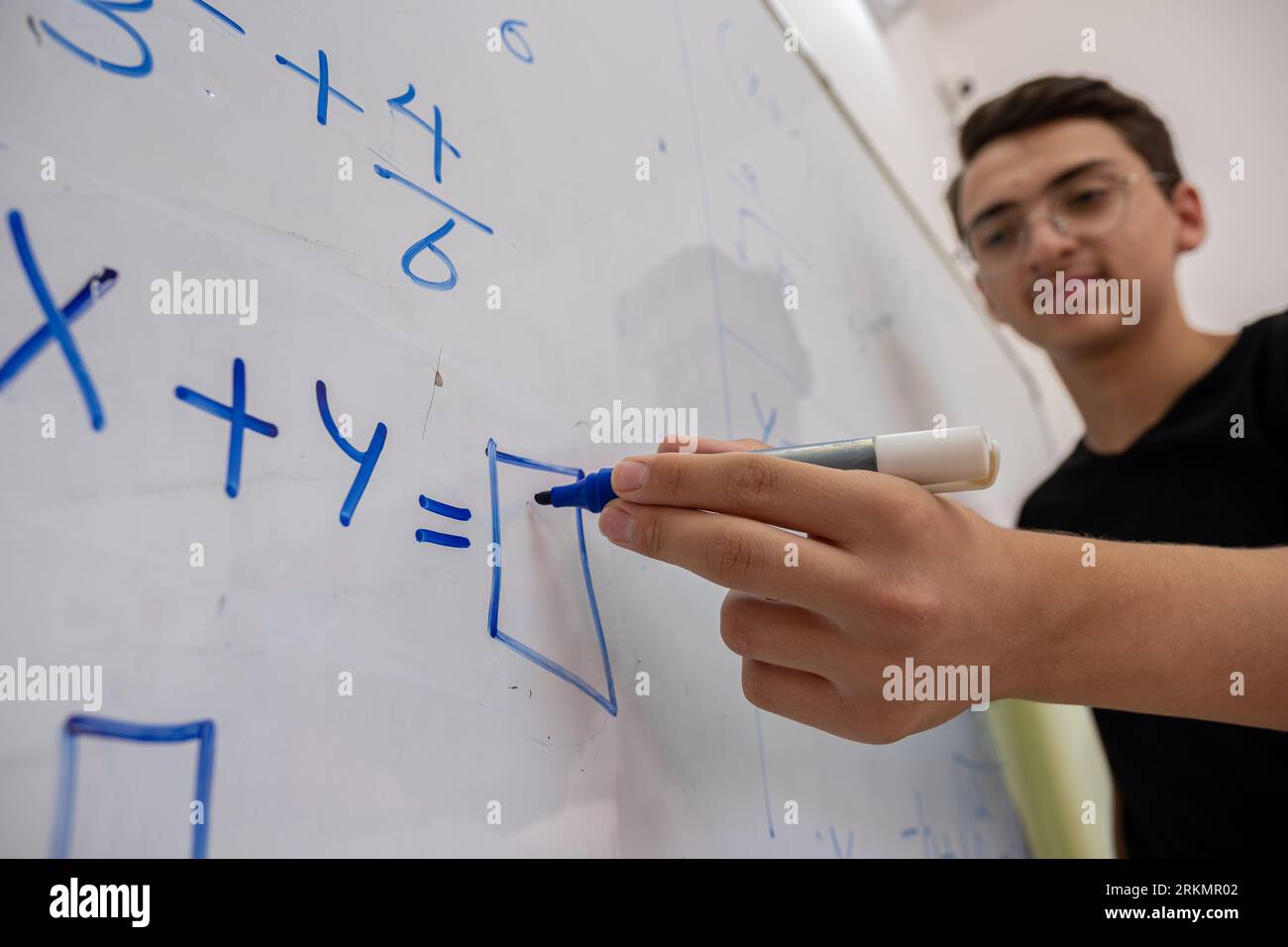 hand of student writing on board Stock Photo - Alamy