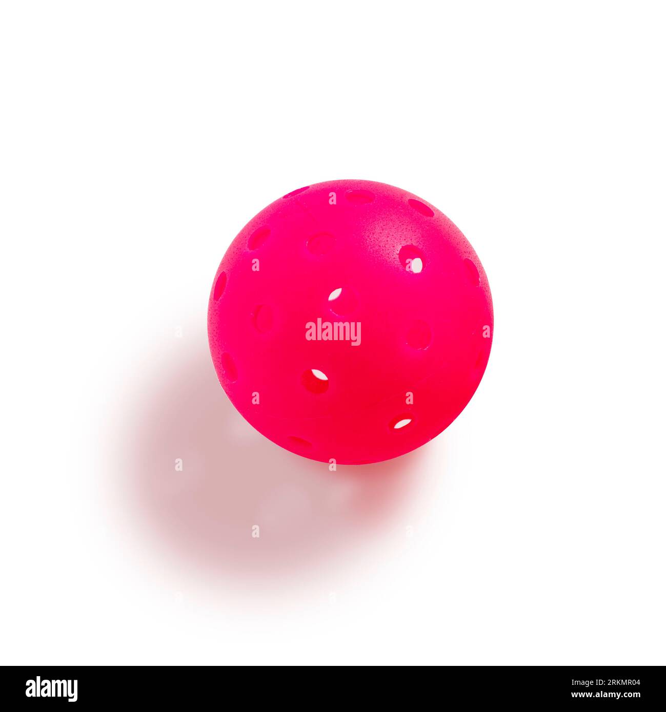 Red pickleball isolated on white Stock Photo - Alamy