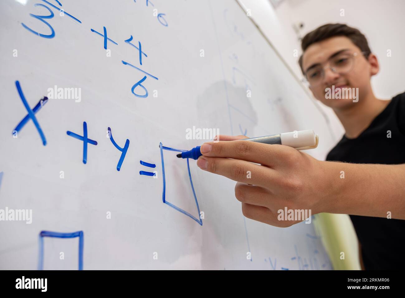 hand of student writing on board Stock Photo - Alamy