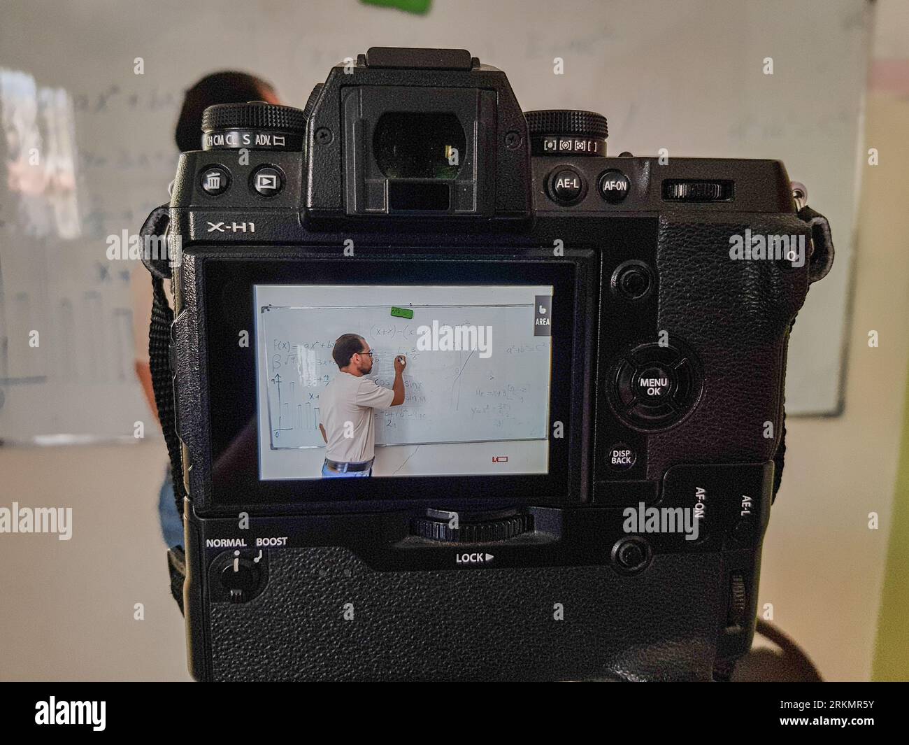 Teacher filming and streaming his lessons for the students through ...