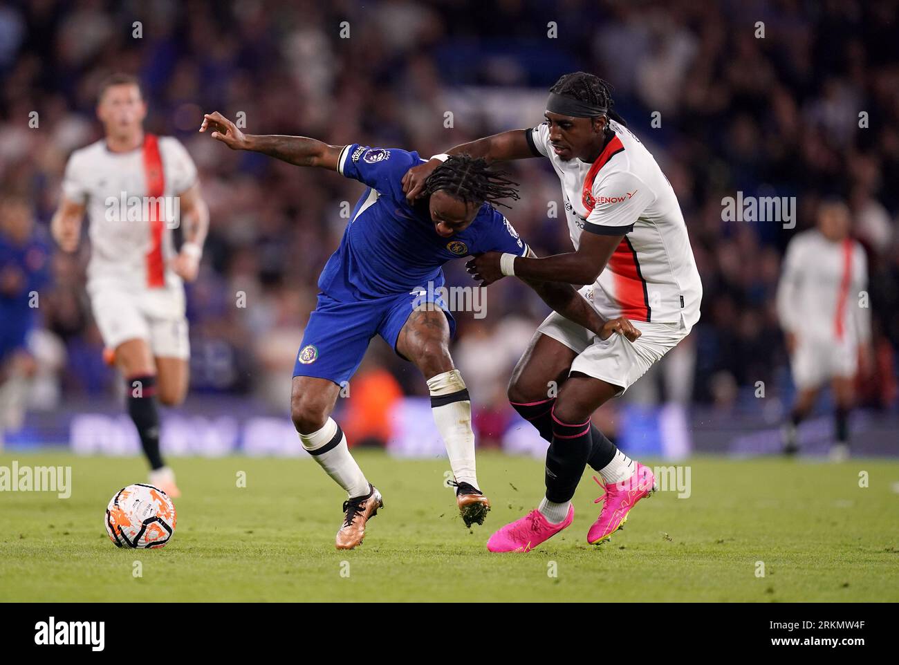 Chelsea's Raheem Sterling holds off Luton Town's Amari'i Bell during ...
