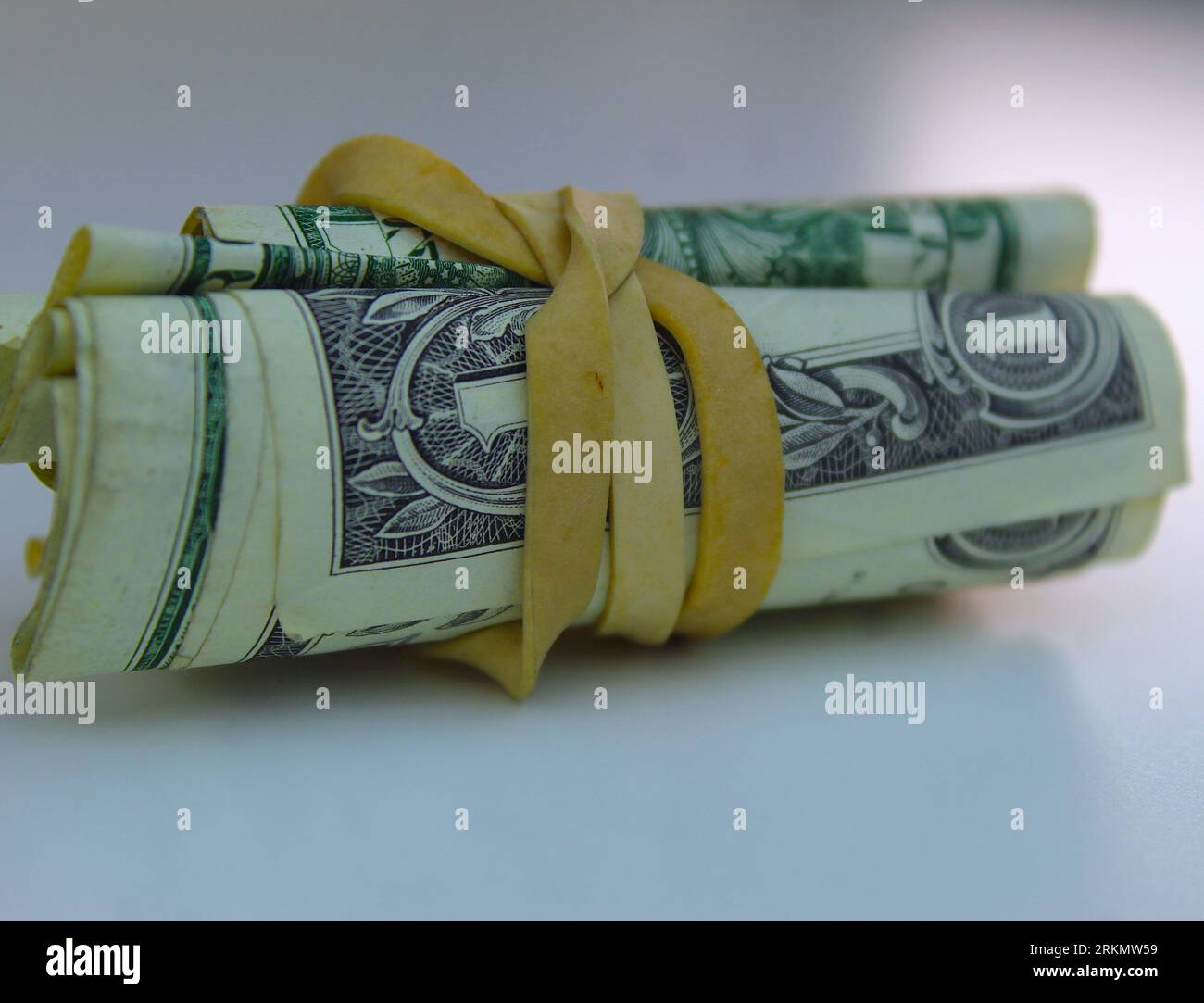 Rolled up dollar notes hi-res stock photography and images - Alamy