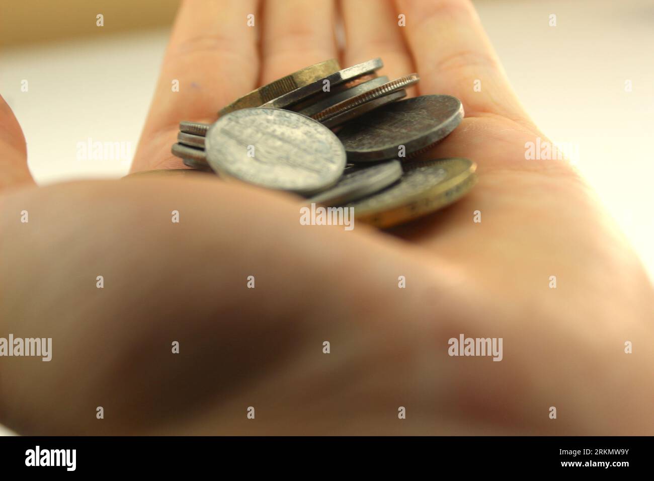 Hand holding several metal hi-res stock photography and images - Alamy