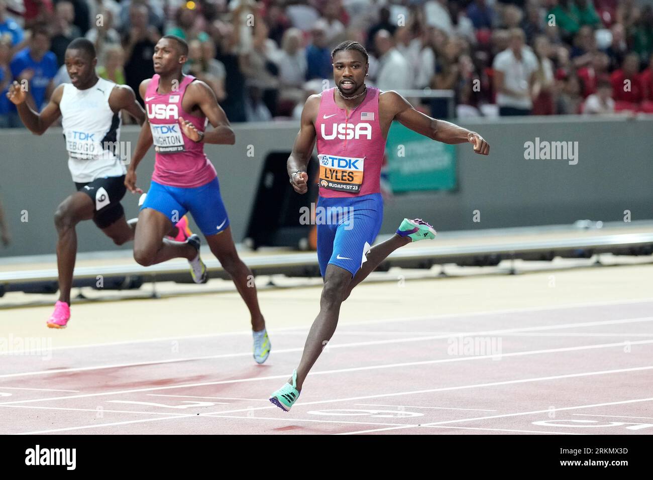Noah Lyles, of the United States, crosses the finish line to win the ...