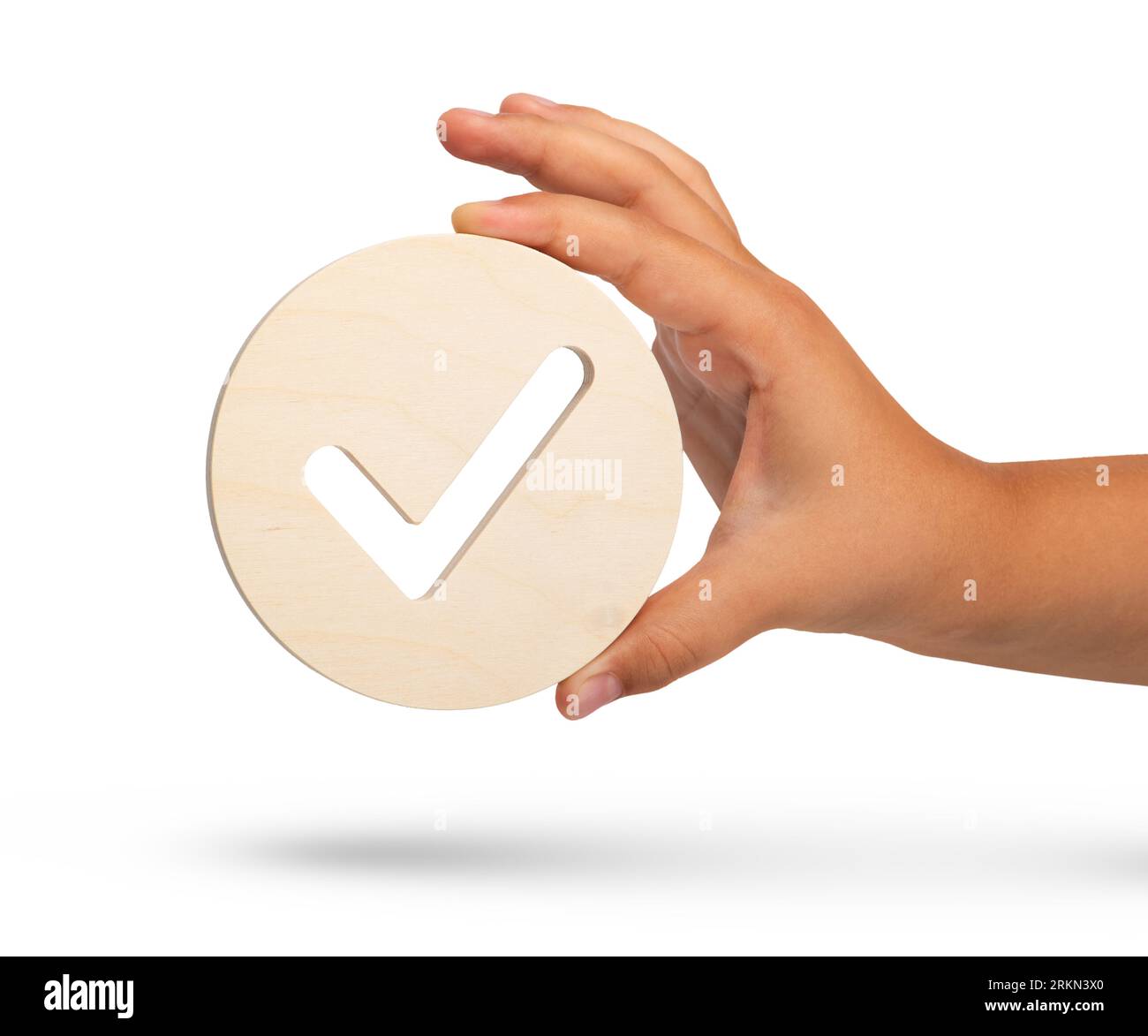 Check mark symbol on white isolated background. Big wooden round badge ...