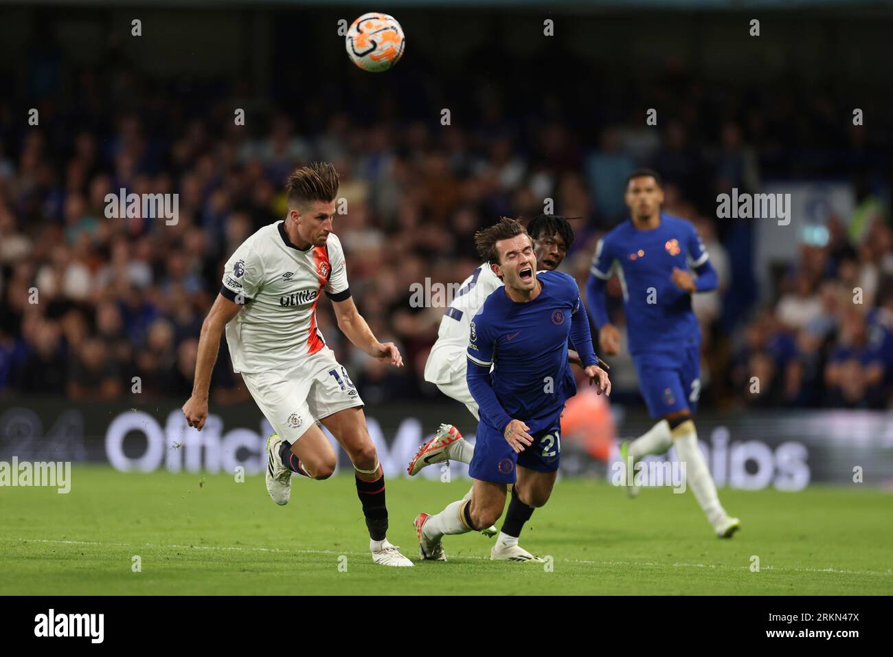 Chelsea's Ben Chilwell, third left, loses his balance as he is tackled ...