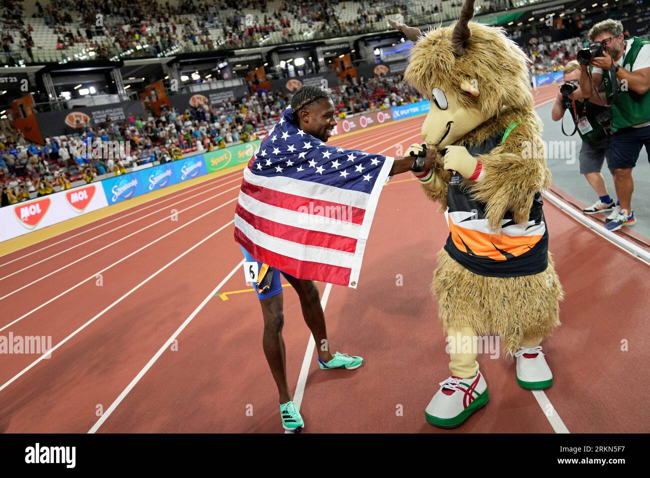 Noah Lyles, of the United States, greets Youhuu, the championship ...