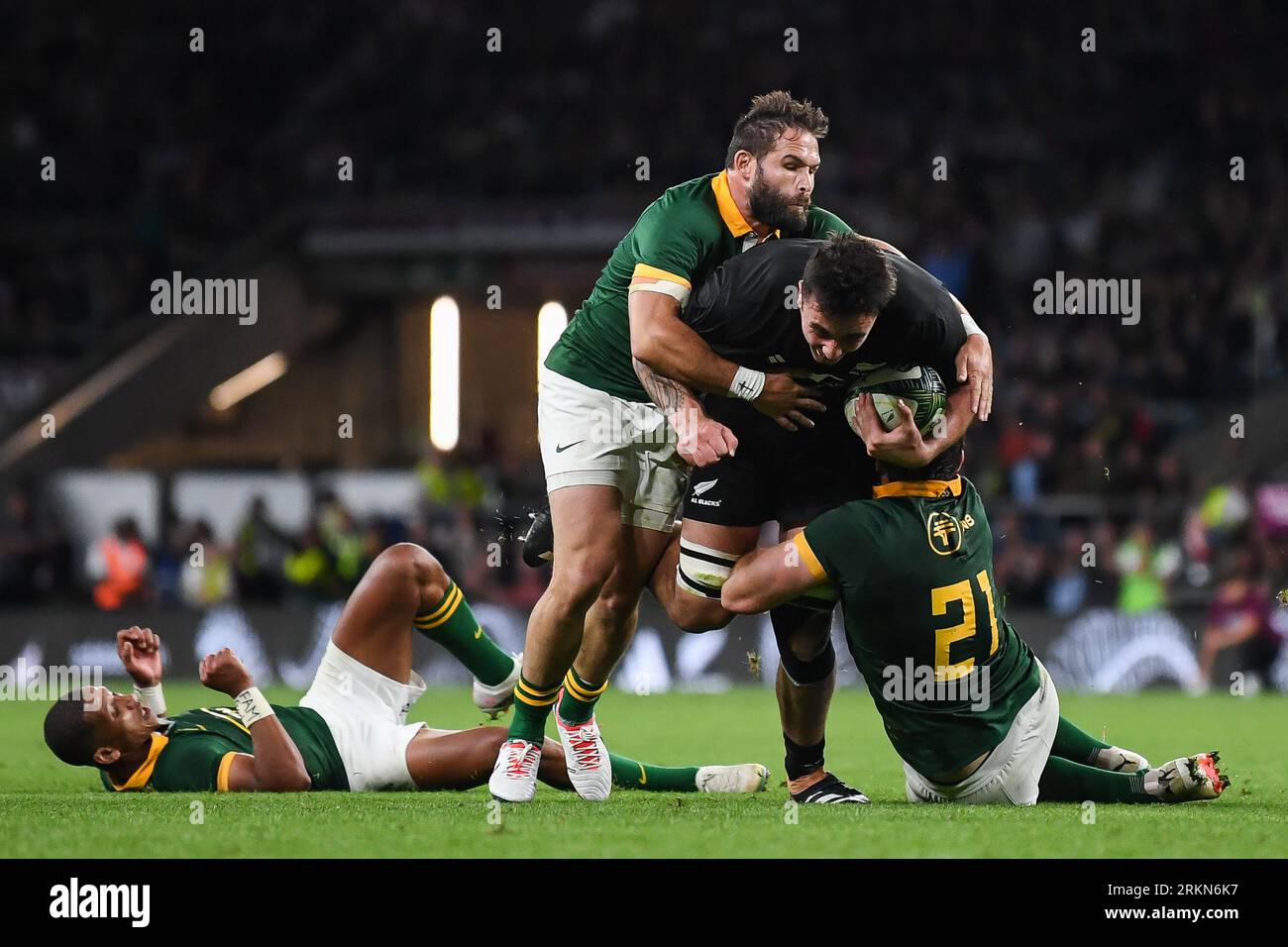 Josh Lord of New Zealand is tackled by Marco van Staden of South Africa ...