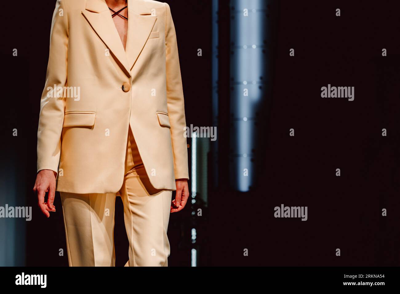 Figure of fashion model woman wearing yellow costume, pants and jacket ...