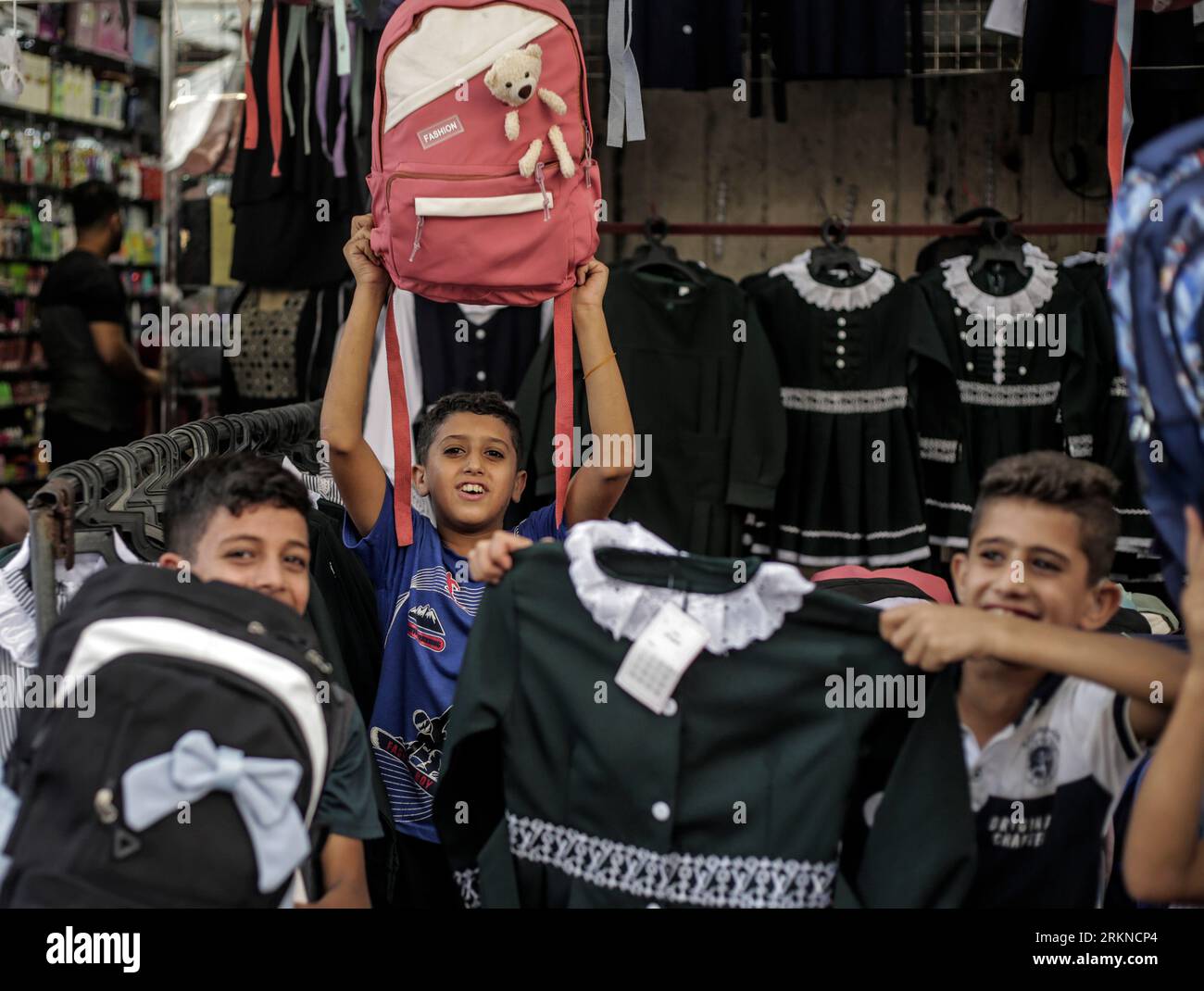 Gaza, Palestine. 25th Aug, 2023. Palestinian children help their father ...