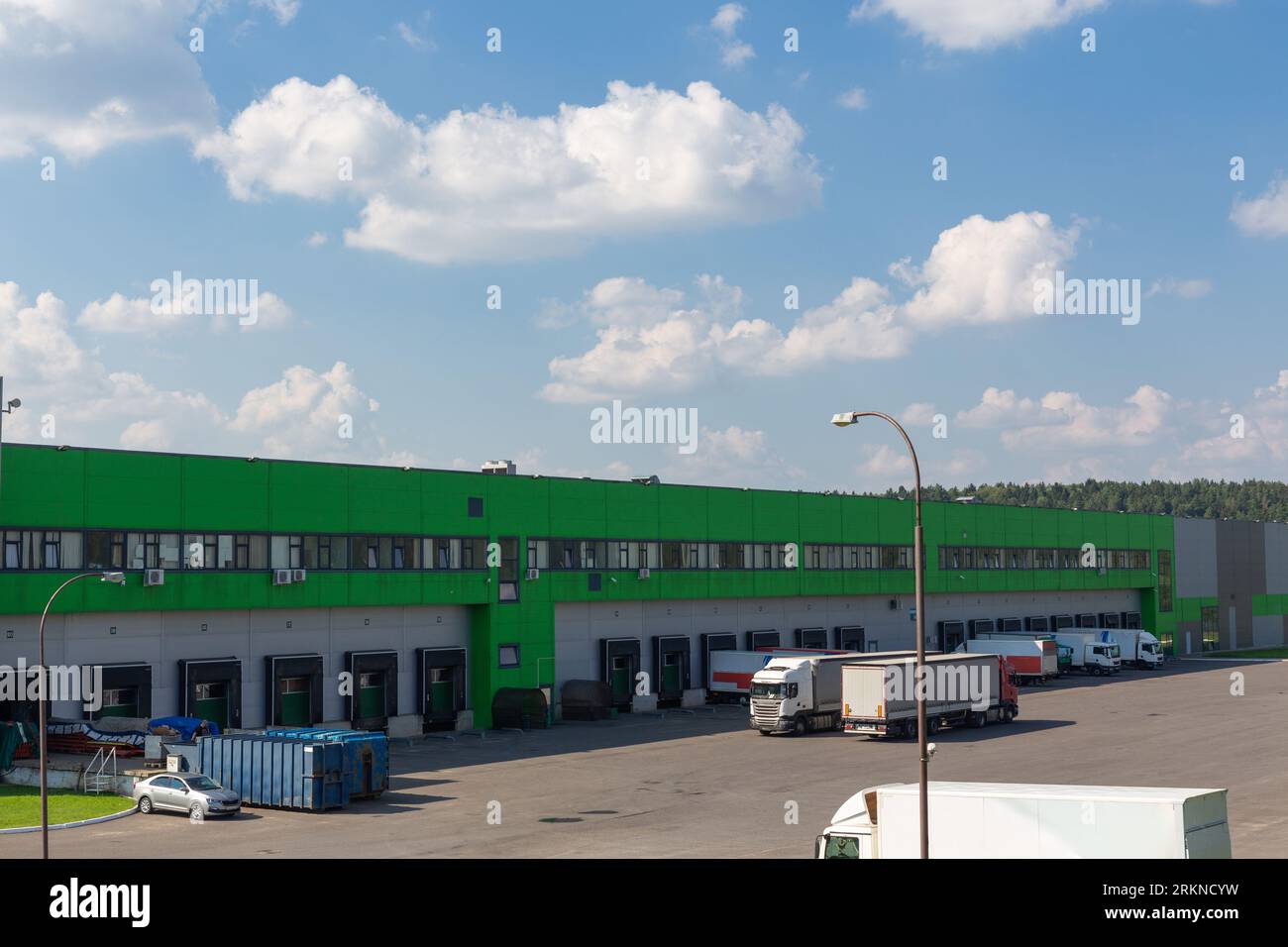 Row of loading docks with shutter doors. Warehouse gates for loading ...