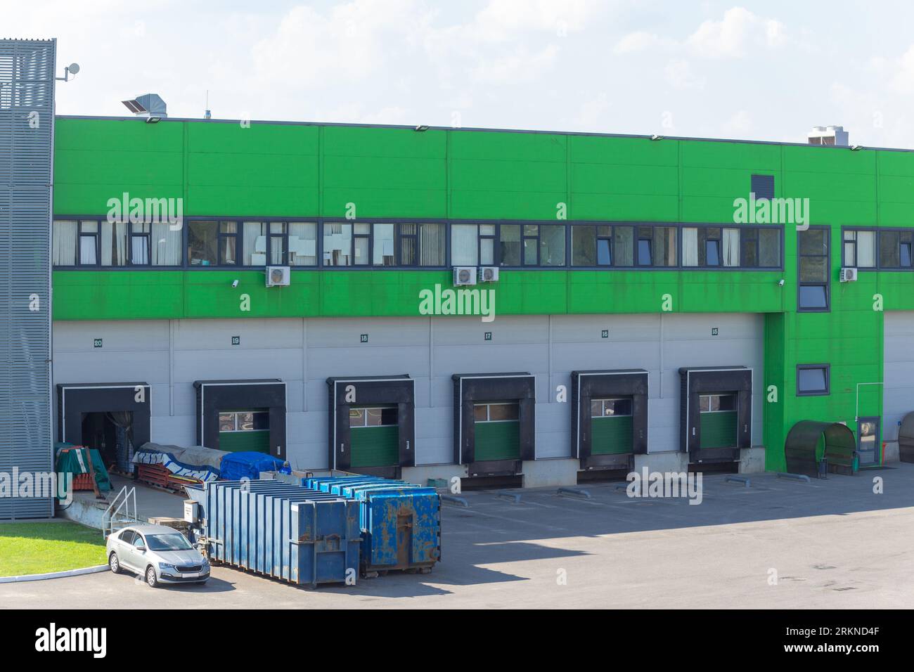 Row of loading docks with shutter doors. Warehouse gates for loading ...