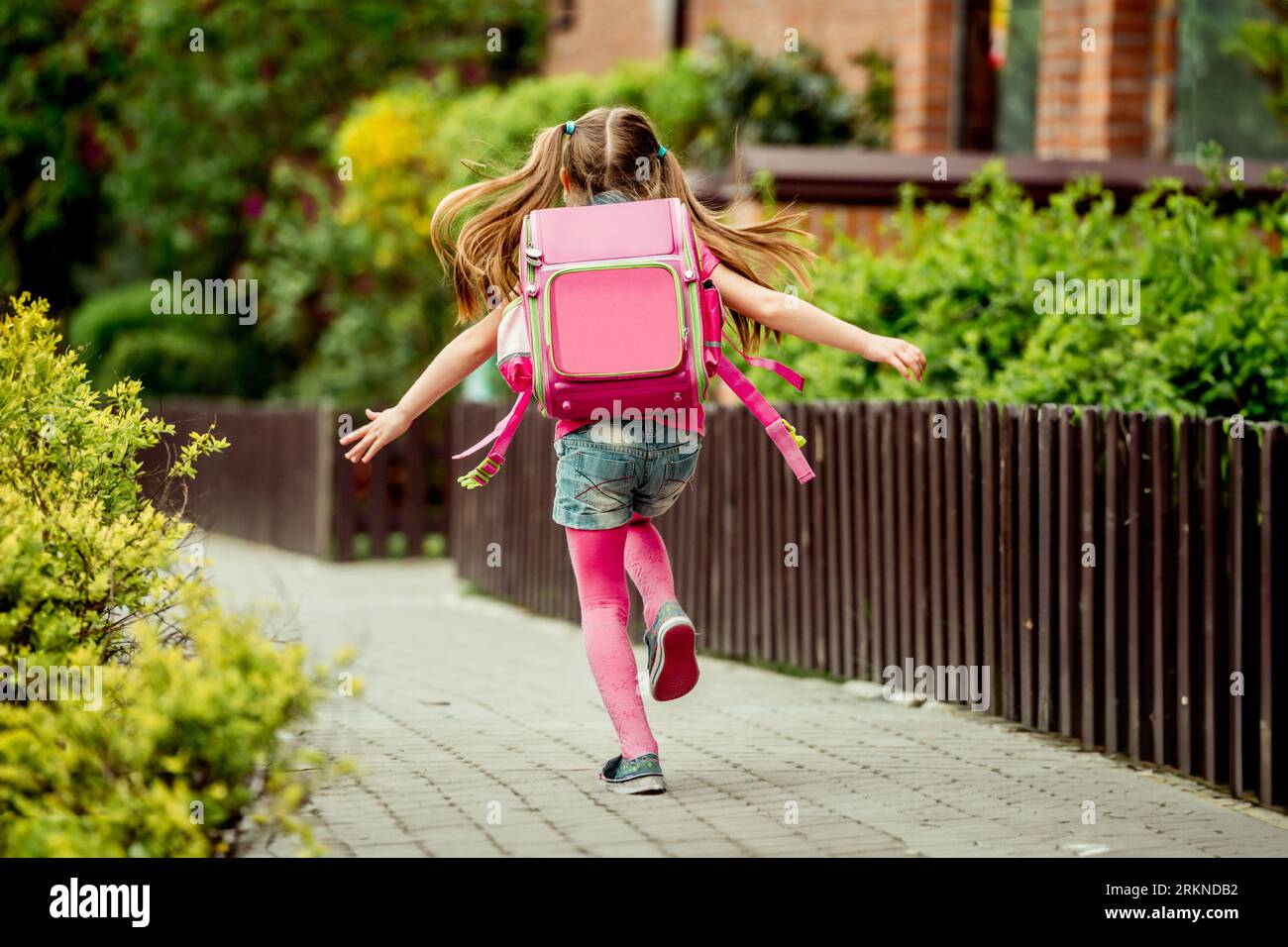 Child run backpack hi-res stock photography and images - Alamy