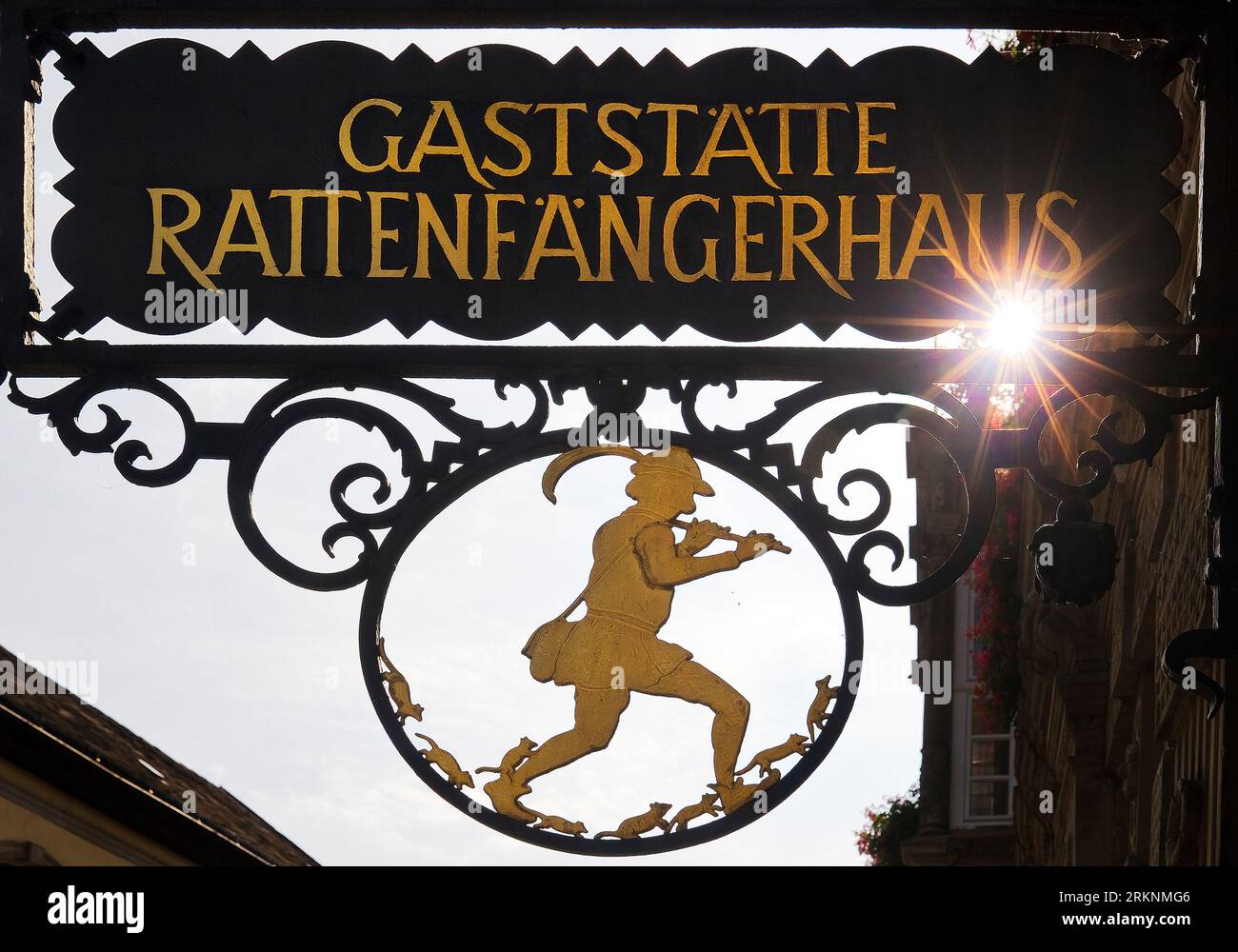 V-shaped sign with the Pied Piper of Hamelin at the Pied Piper's House, Germany, Lower Saxony ...