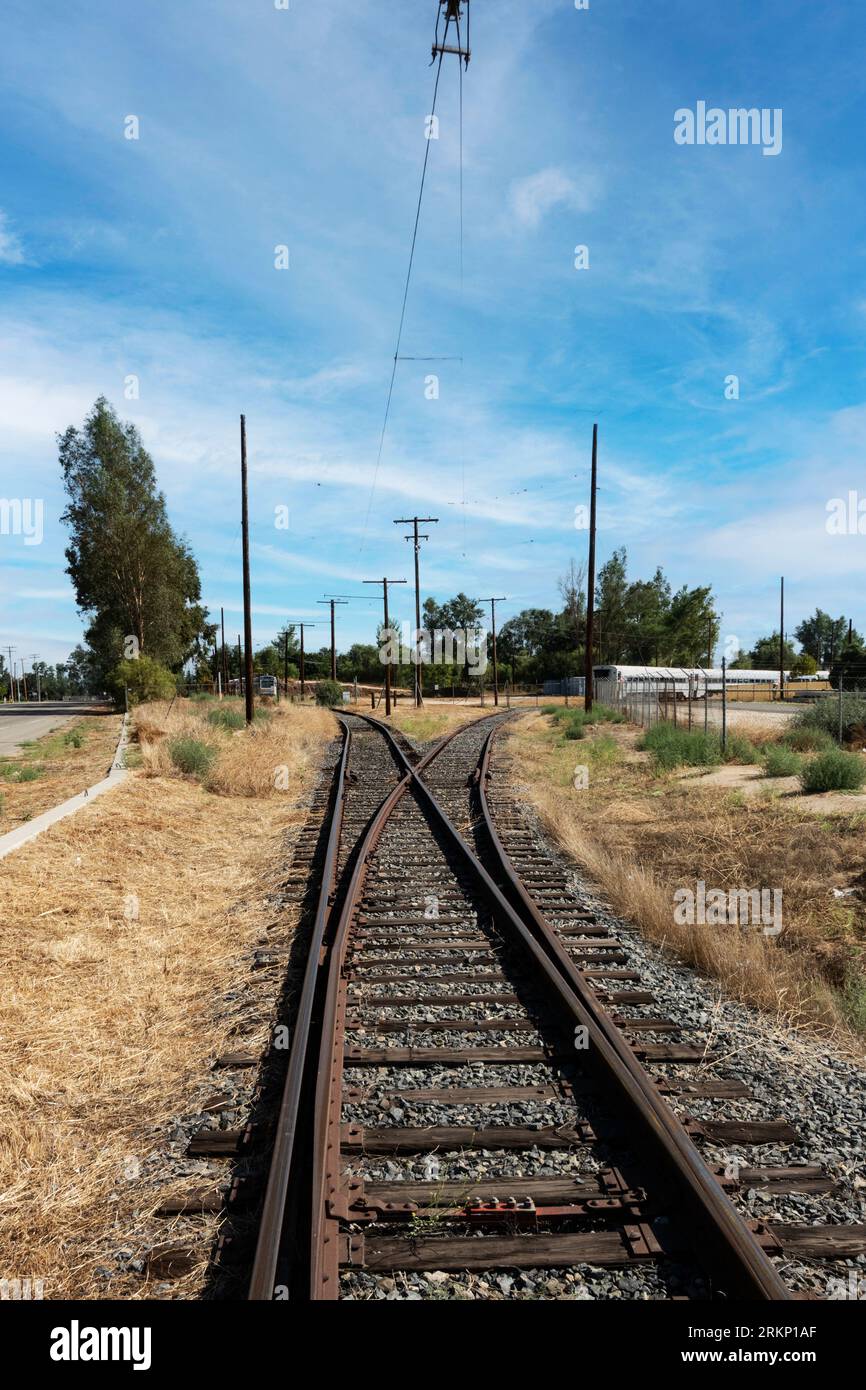 A fork in the distance of obsolete railraod tracks Stock Photo - Alamy