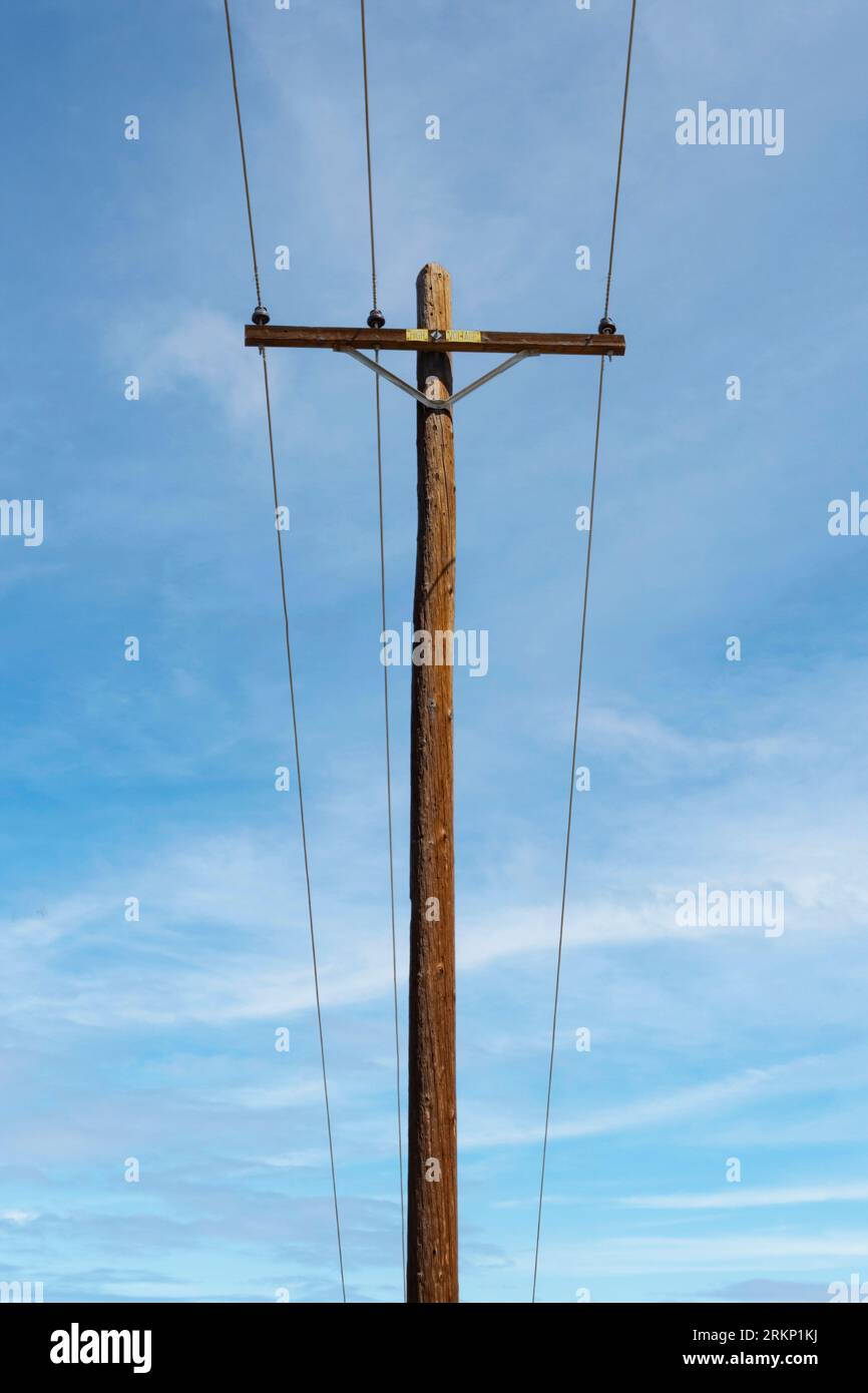 Upward view of an old high voltage power pole overhead Stock Photo - Alamy