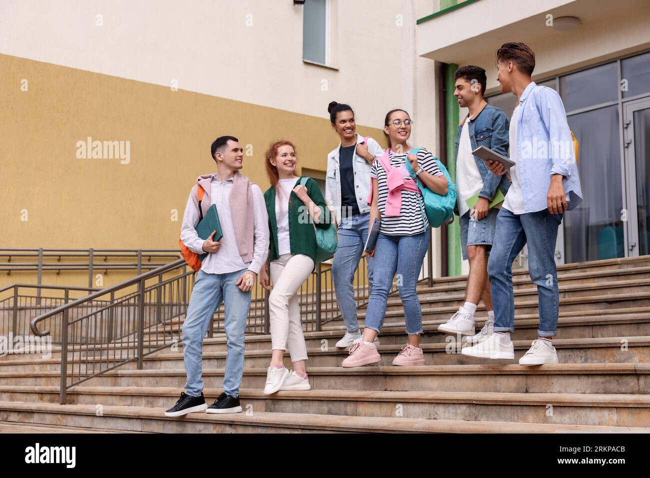 Group of people walking down stairs hi-res stock photography and images ...