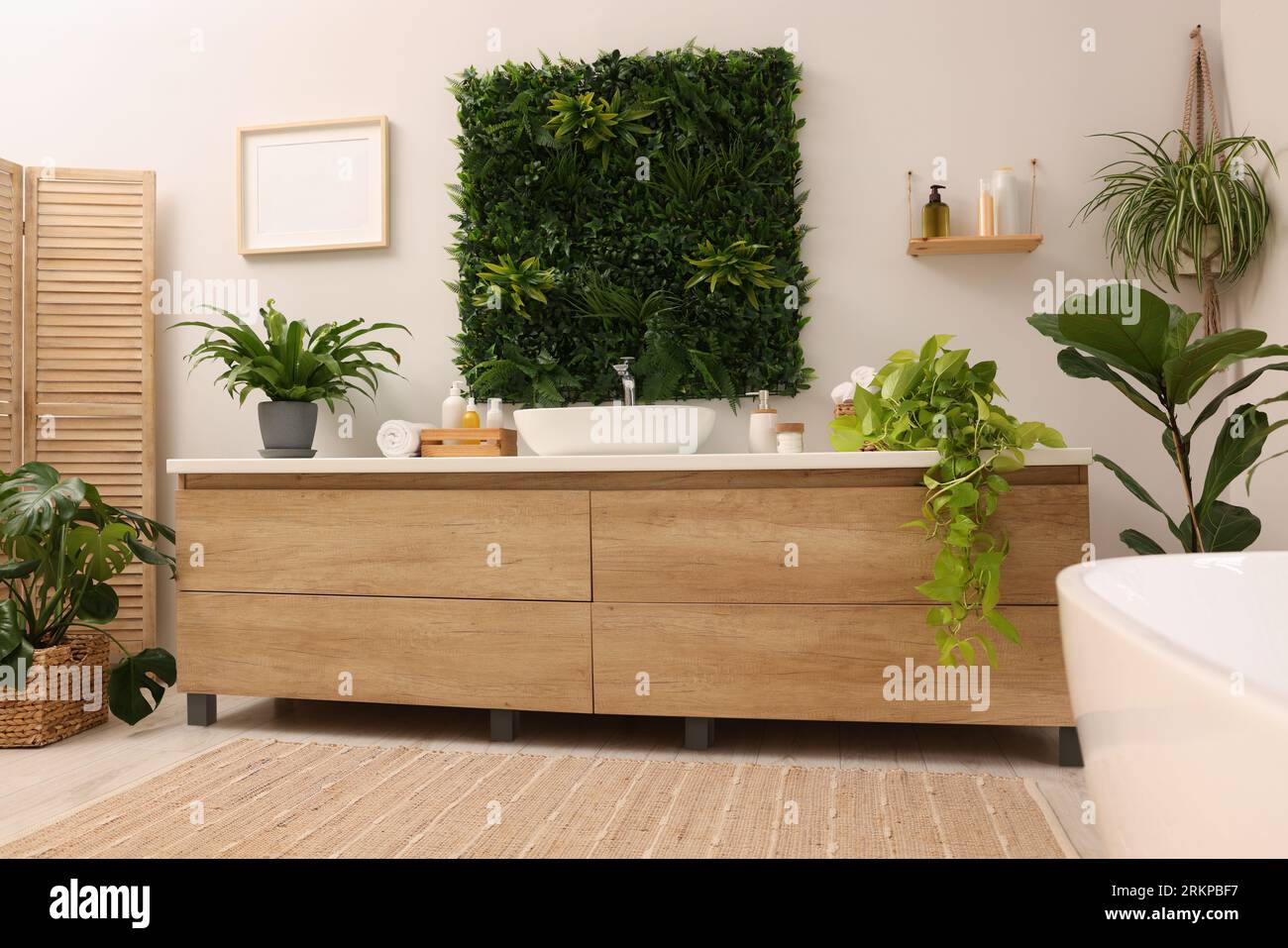 Green artificial plants, vanity and different personal care products in ...