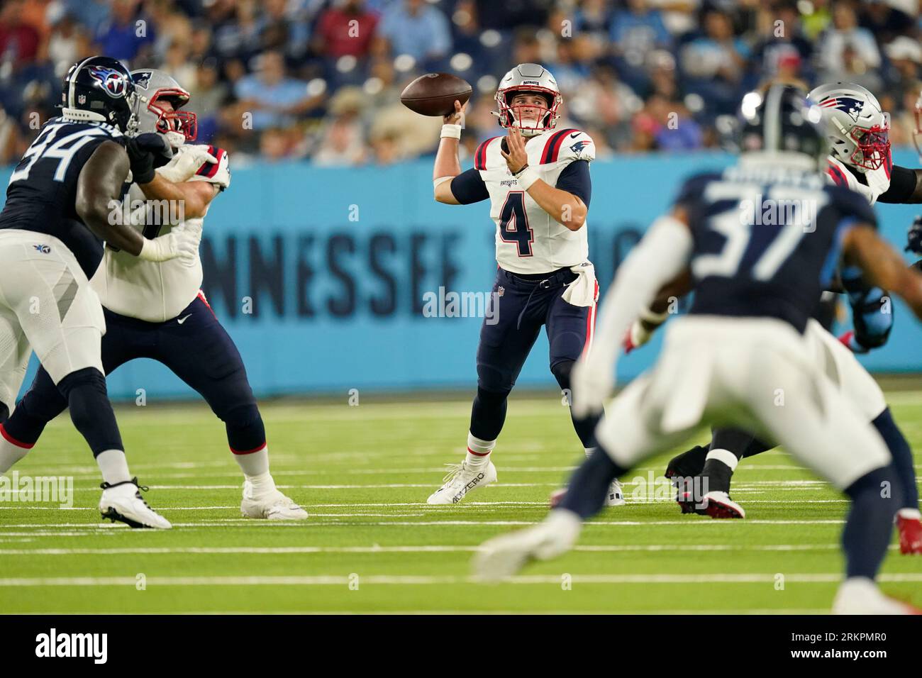 New England Patriots quarterback Bailey Zappe (4) passes in the first ...