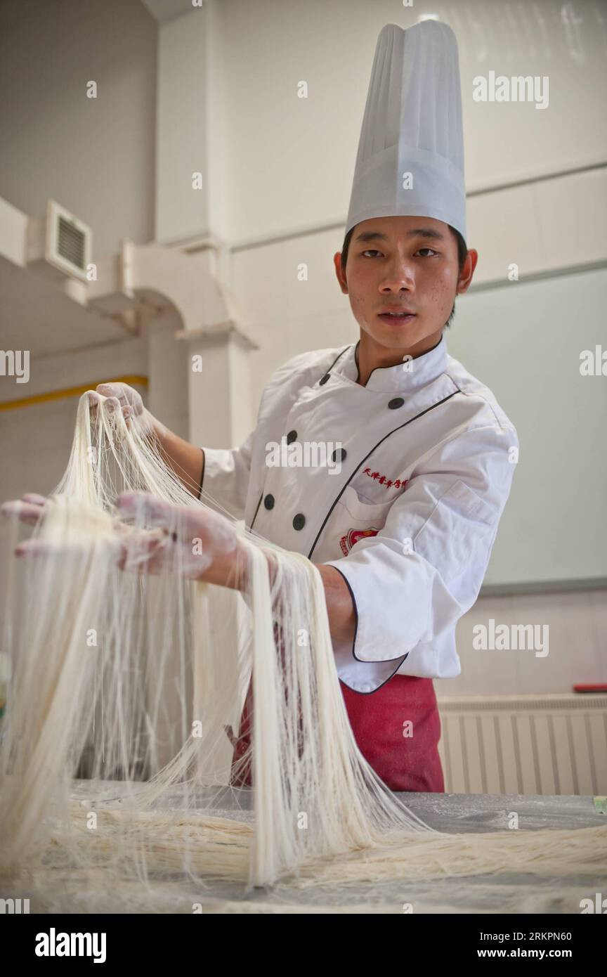 Very long noodles in the world hi-res stock photography and images - Alamy