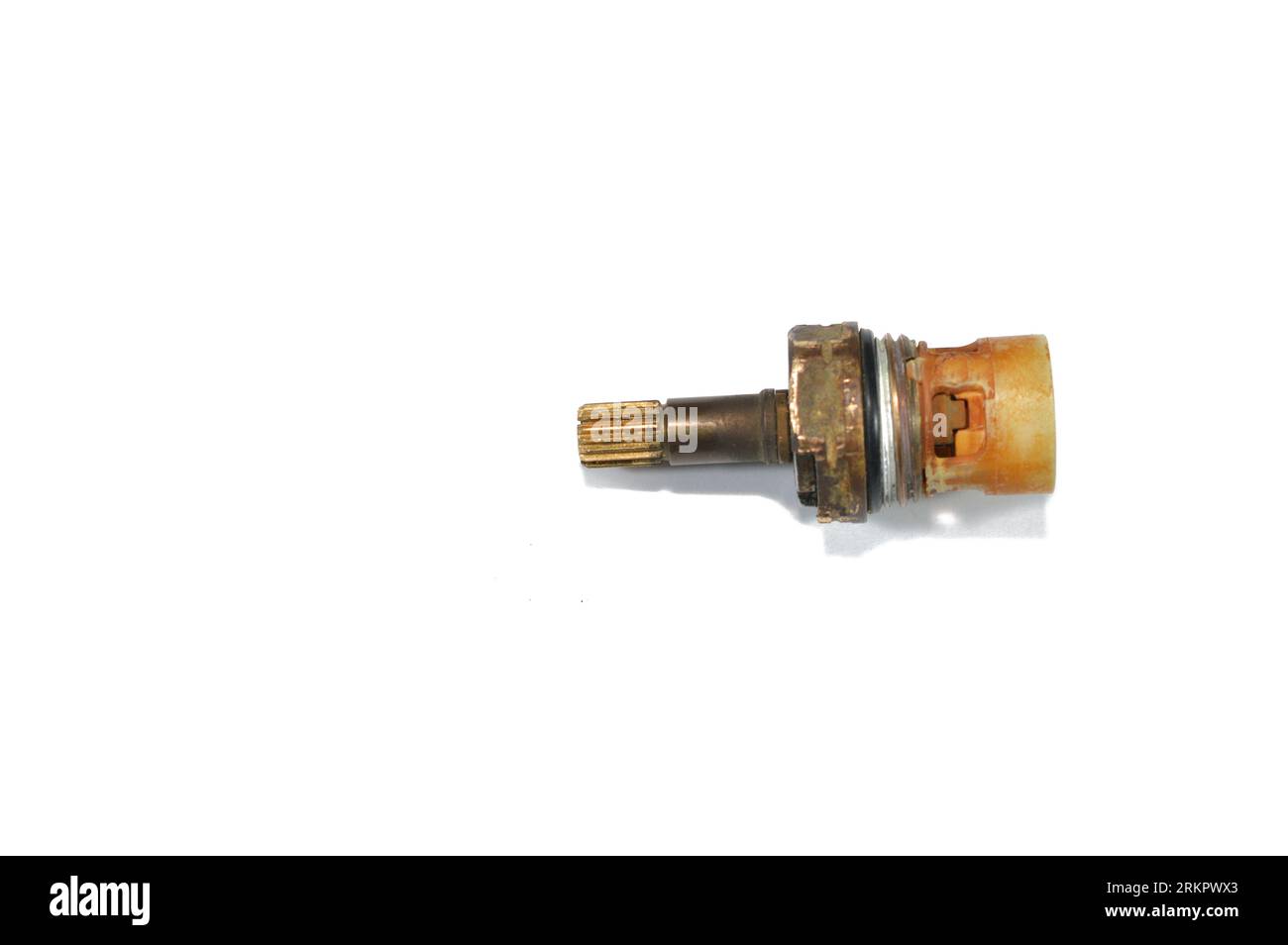 A used shower faucet tap body cartridge parts of plastic and copper ...