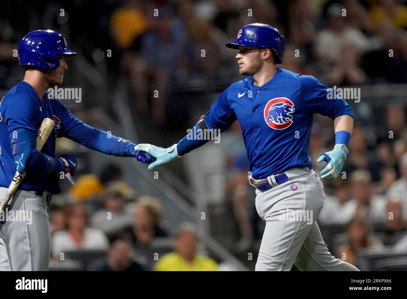 Chicago Cubs' Ian Happ, right, celebrates after his home run against ...