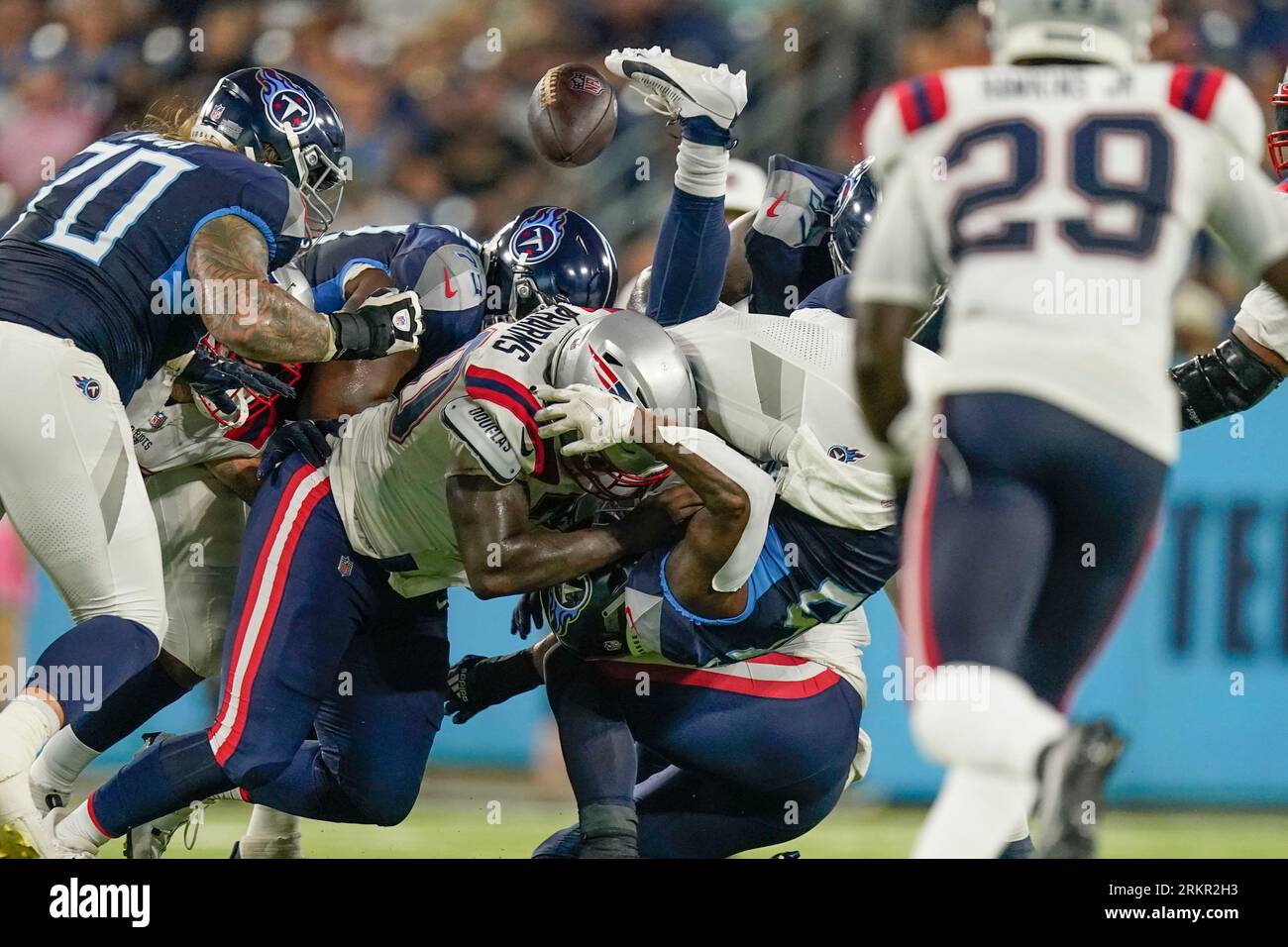 Tennessee Titans running back Julius Chestnut fumbles as he is hit by ...
