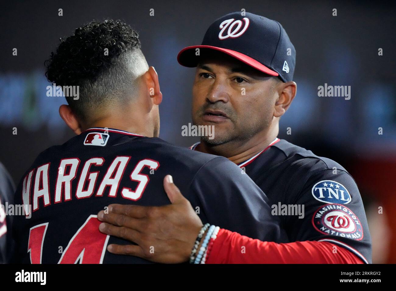 Washington Nationals manager Dave Martinez, right, embraces left ...