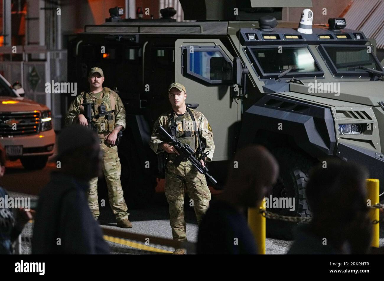 NASA security personnel stand watch before astronauts walk out to board ...
