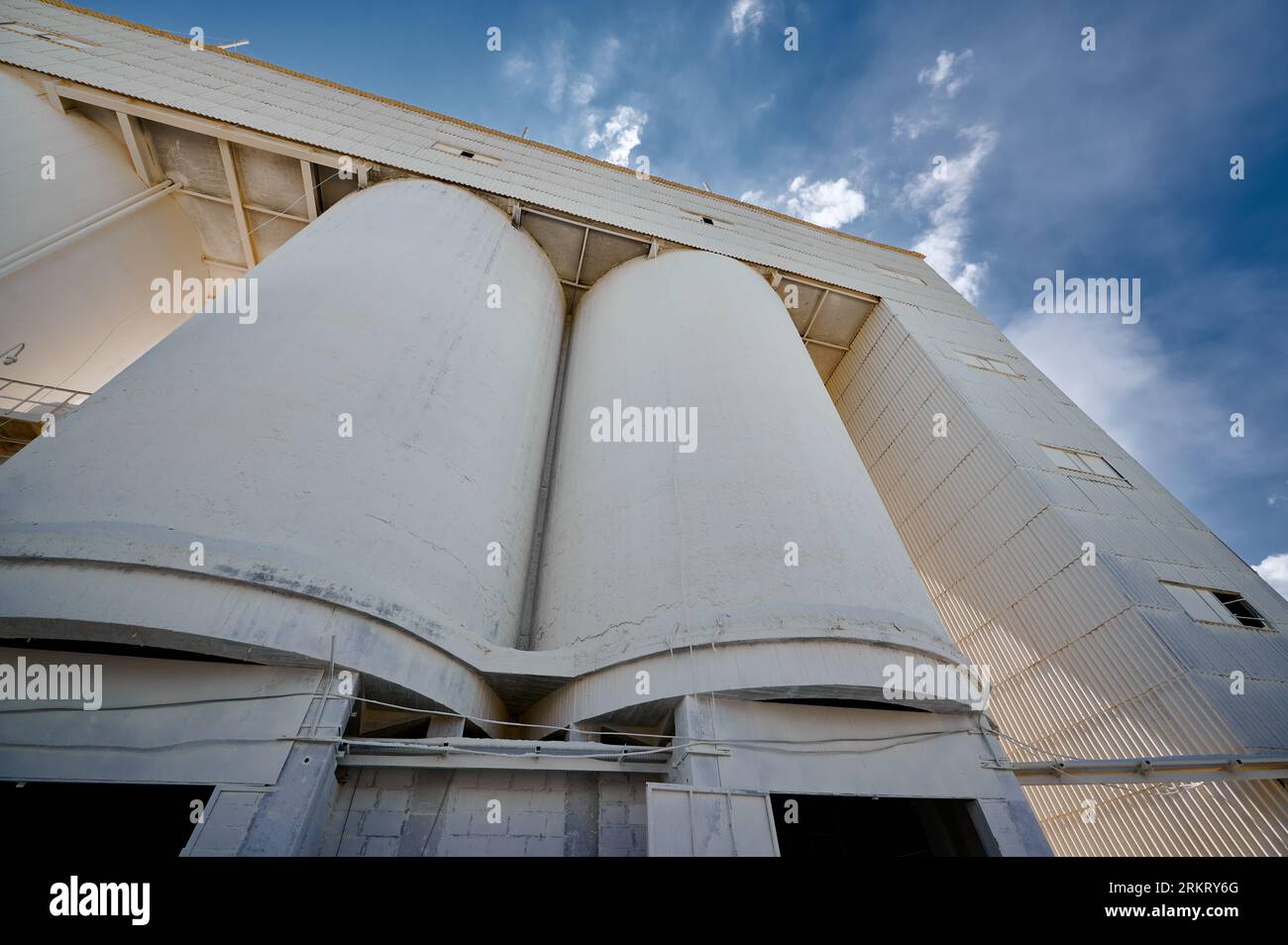 Large concrete silos for construction materials storage Stock Photo - Alamy