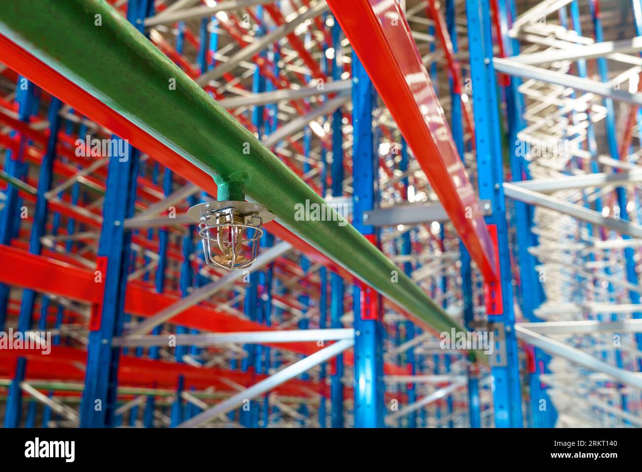 Fire sprinkler in a large warehouse with metal shelving Stock Photo - Alamy