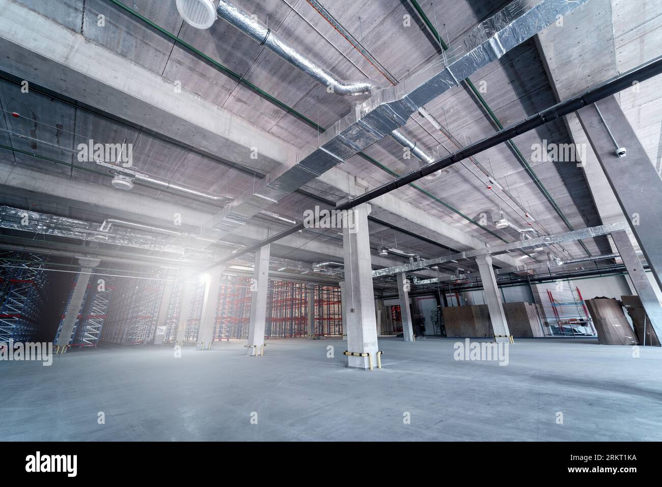 Interior of an industrial building. Huge warehouse under construction ...