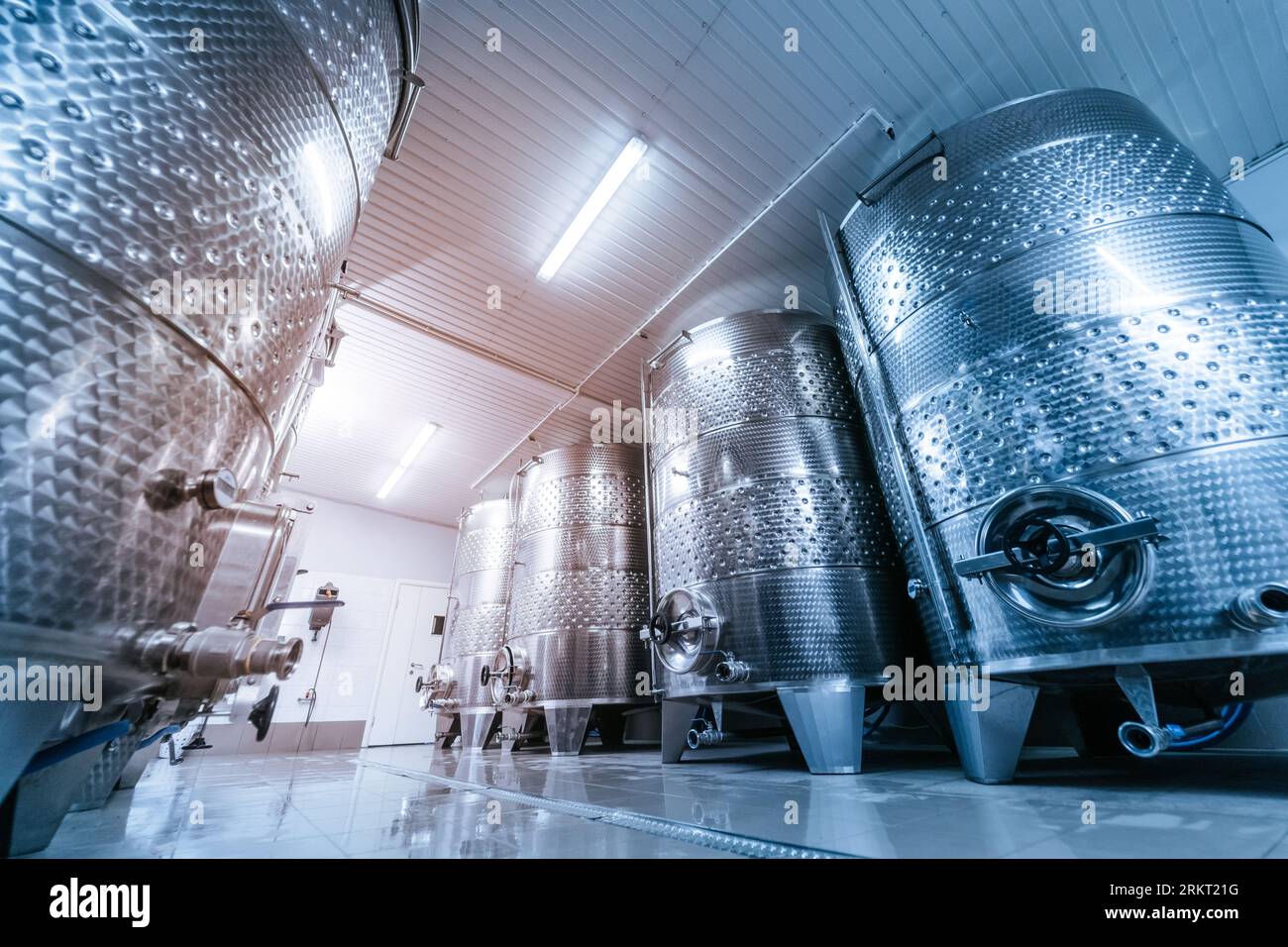 Modern winery with stell barrels Stock Photo - Alamy