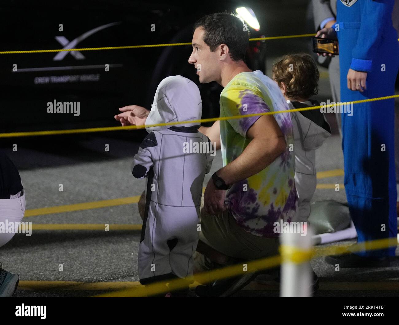 Sam Wald, husband of NASA astronaut Jasmin Moghbeli, waits with their ...