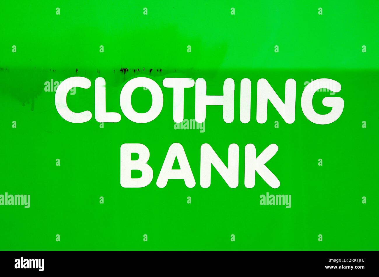 White lettering on green clothing bank access door Stock Photo - Alamy