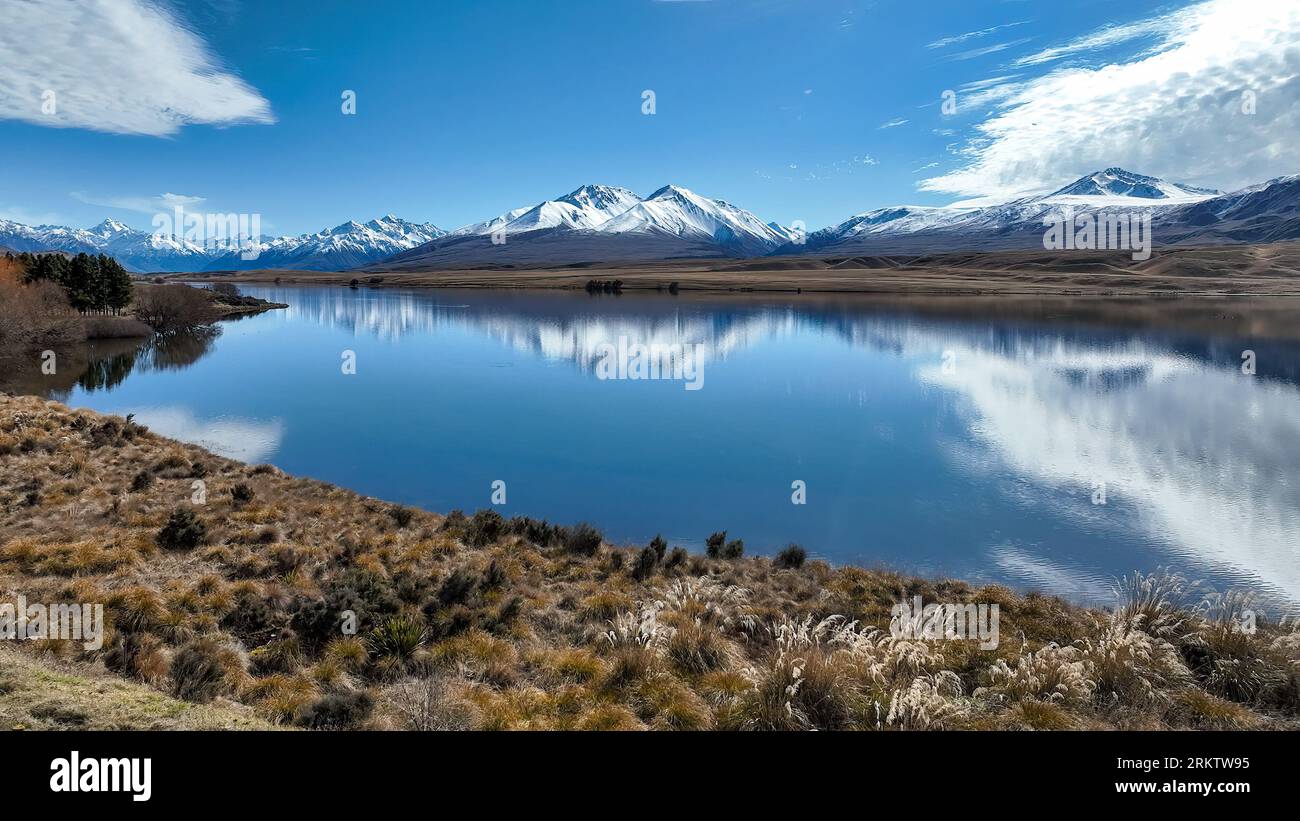 Reflections on the calm surface of Lake Clearwater in the Hakatere ...
