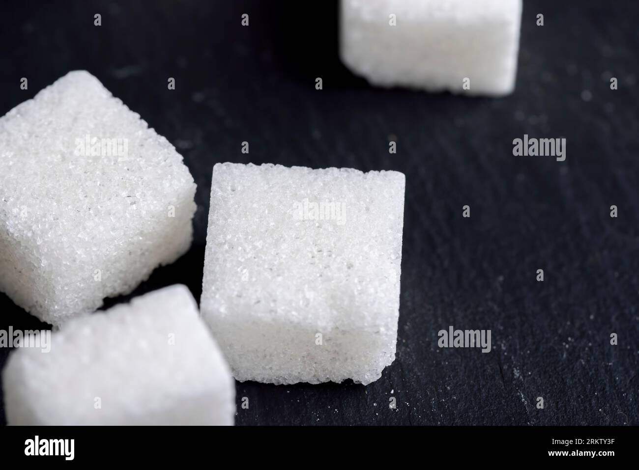 White sugar made from beetroot, cubes of white beet sugar close-up ...